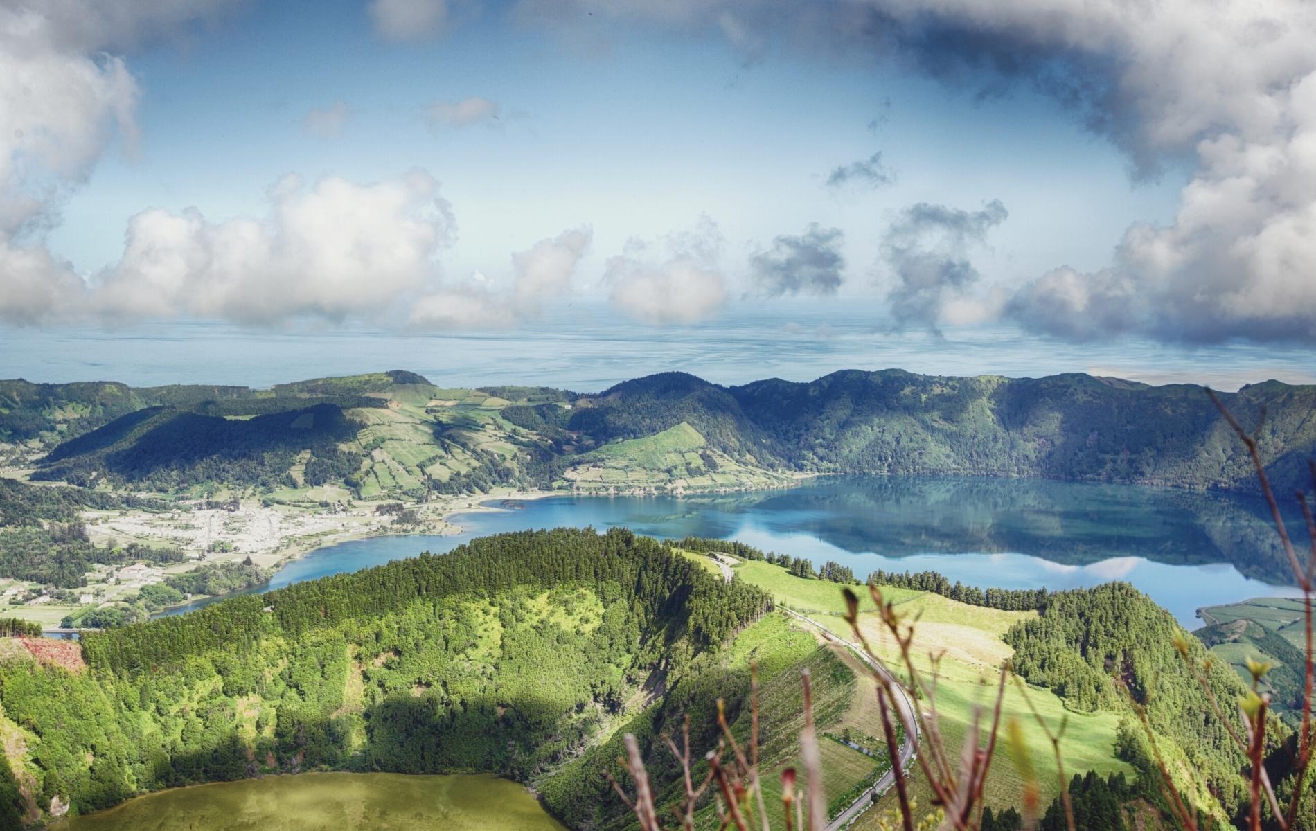 The Sete Cidades glimmering twin lakes surrounded by hydrangeas and ...